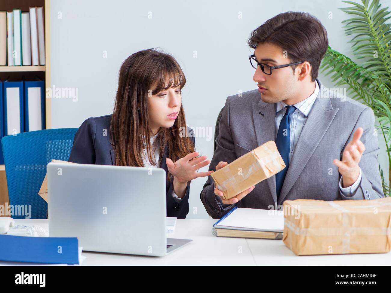 The business people receiving new mail and parcels Stock Photo - Alamy