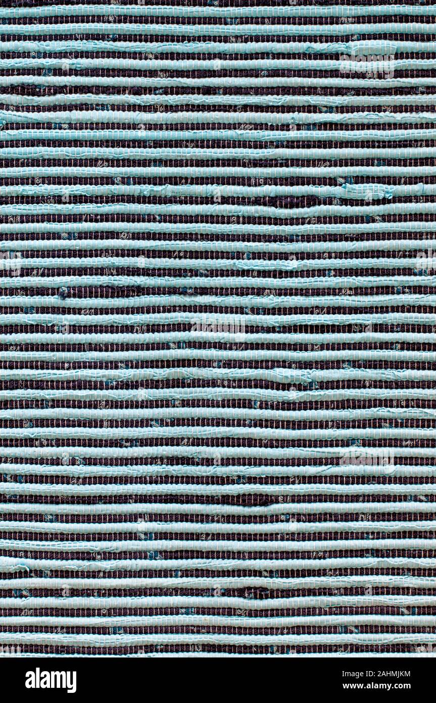 Closeup of woven mesh textile background with even spaced warp and woof ...