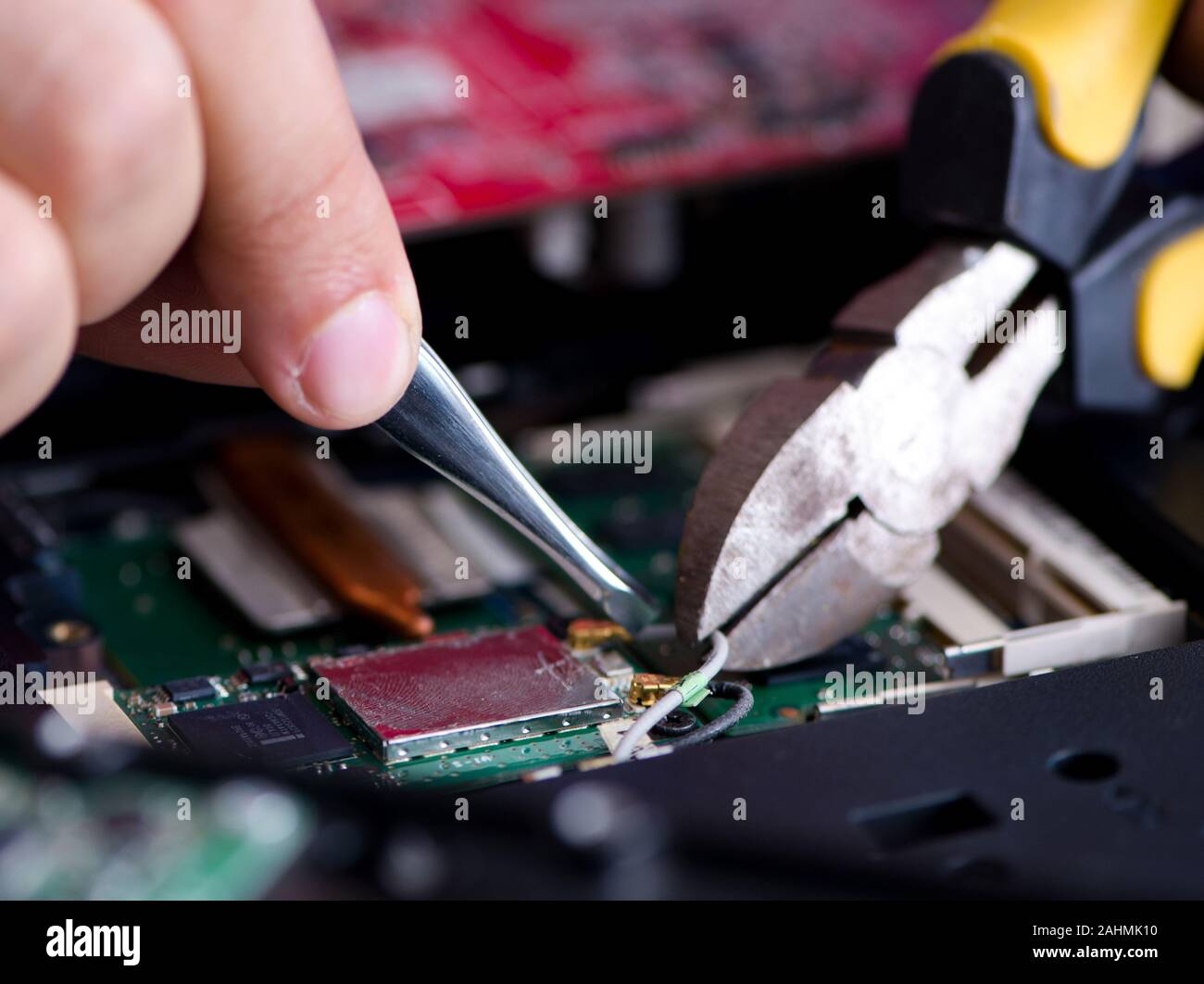 Repairman working in technical support fixing computer laptop ...