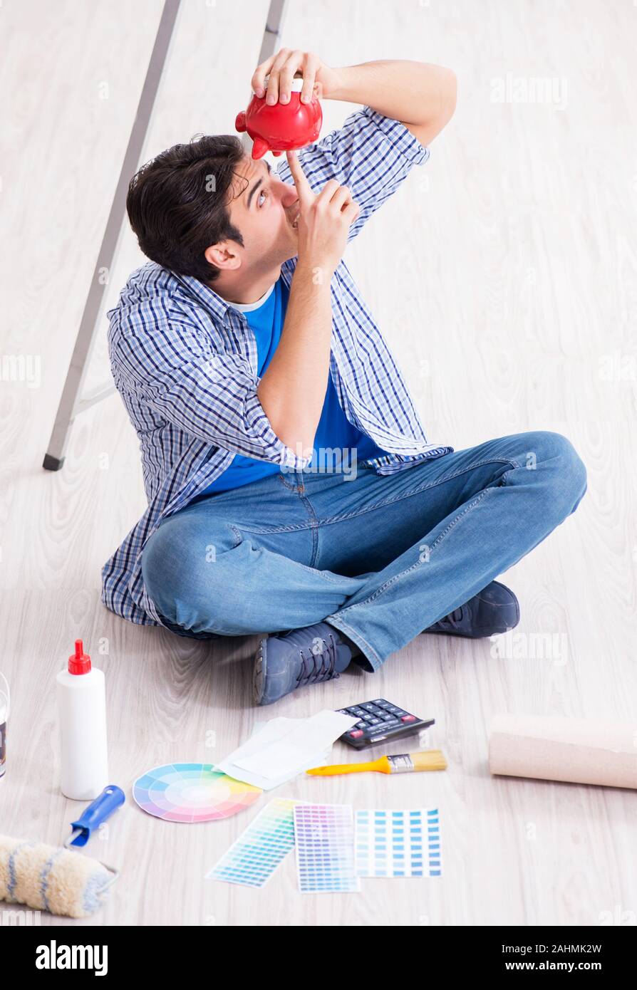 Young man overspending his budget in refurbishment project Stock Photo ...