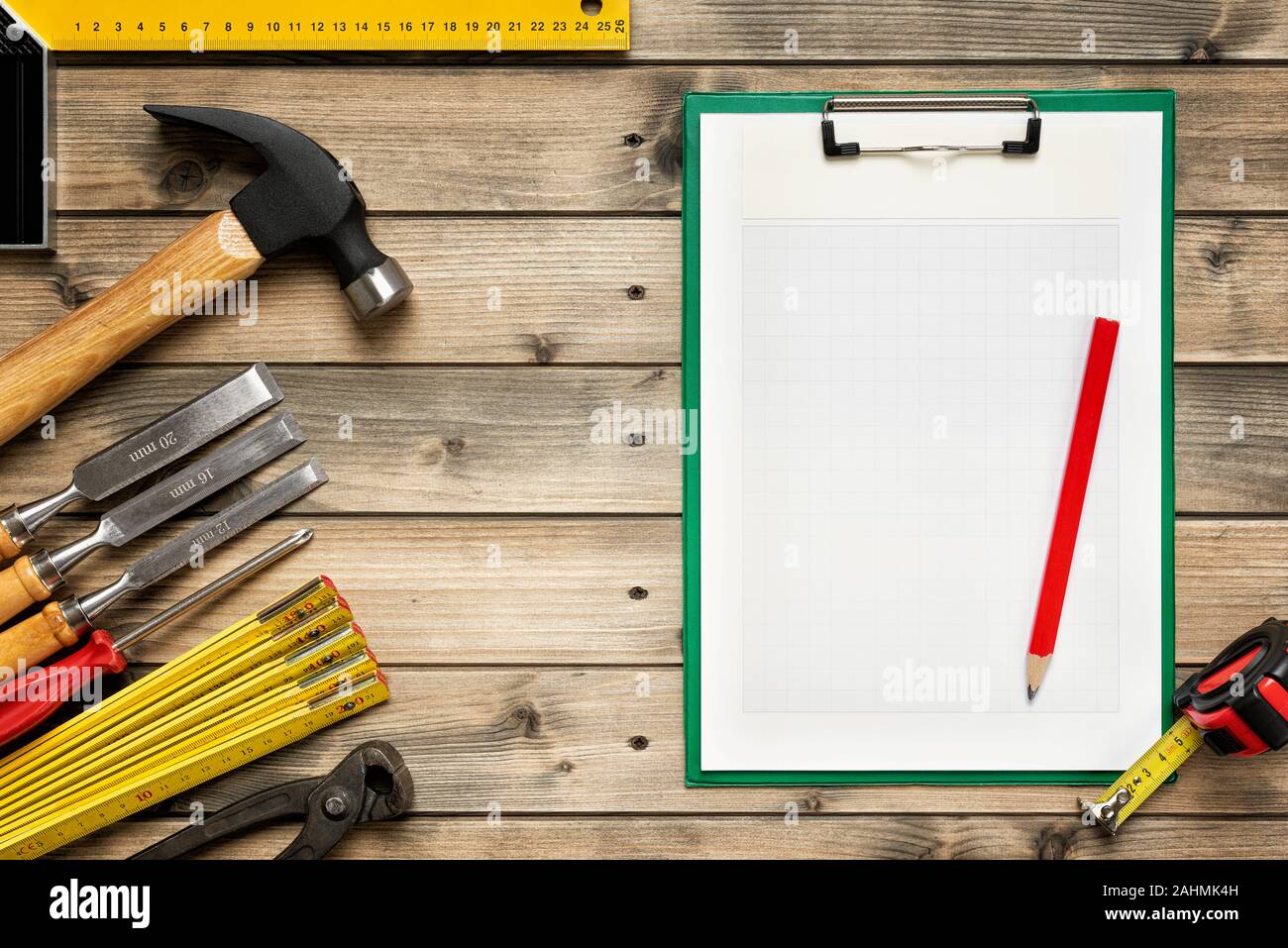 Top view of carpenter work tools and notebook for notes on an antique ...