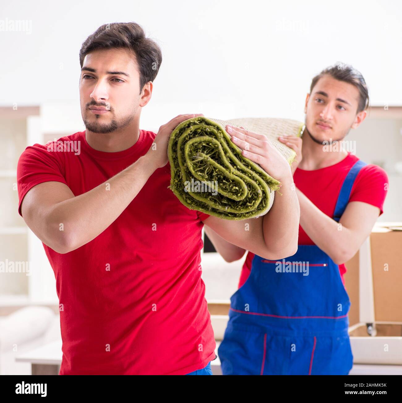 The two contractor employees moving personal belongings Stock Photo - Alamy