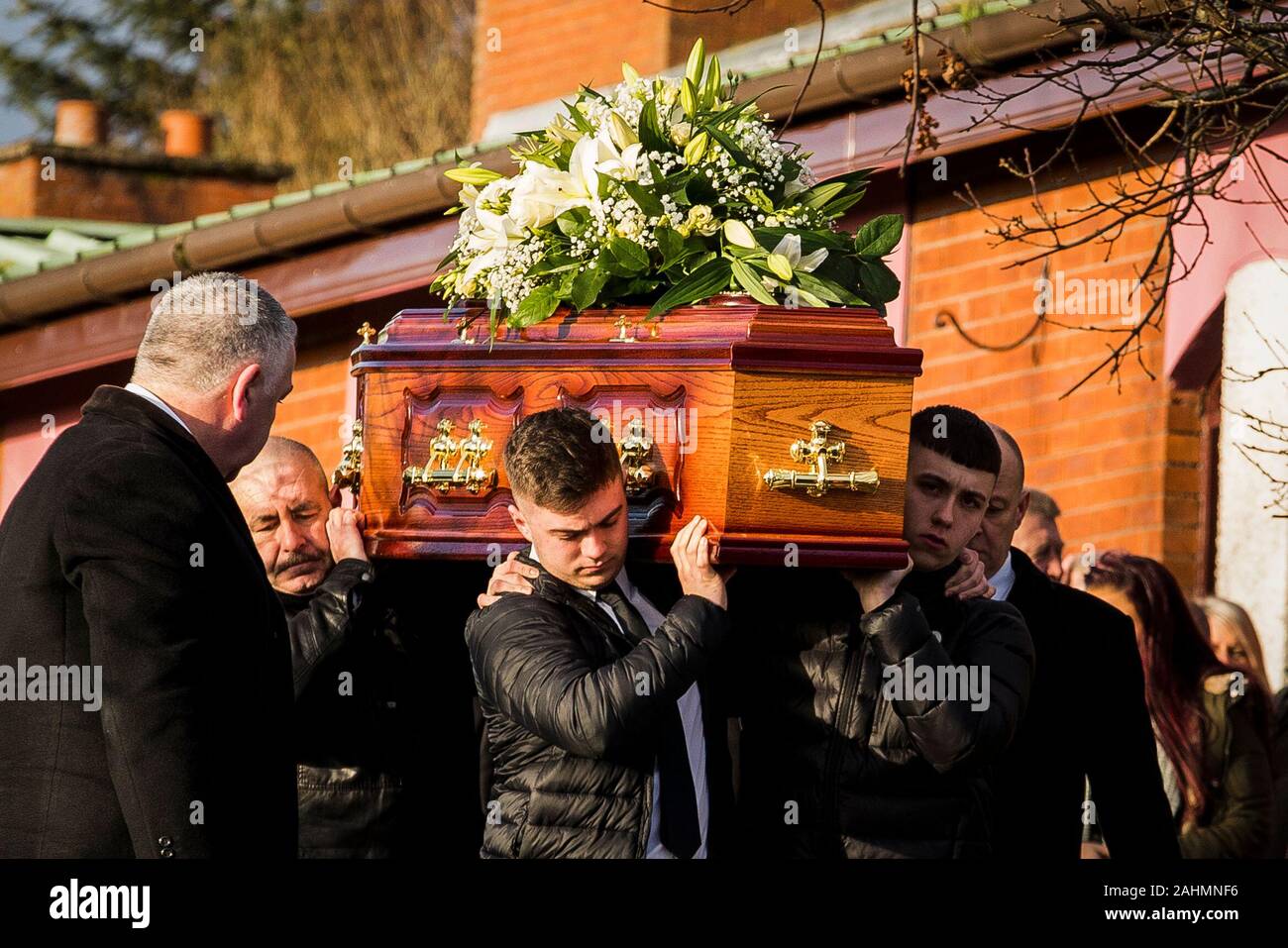Pallbearers carry the coffin of stabbing victim Joseph (Joe) Dutton ...
