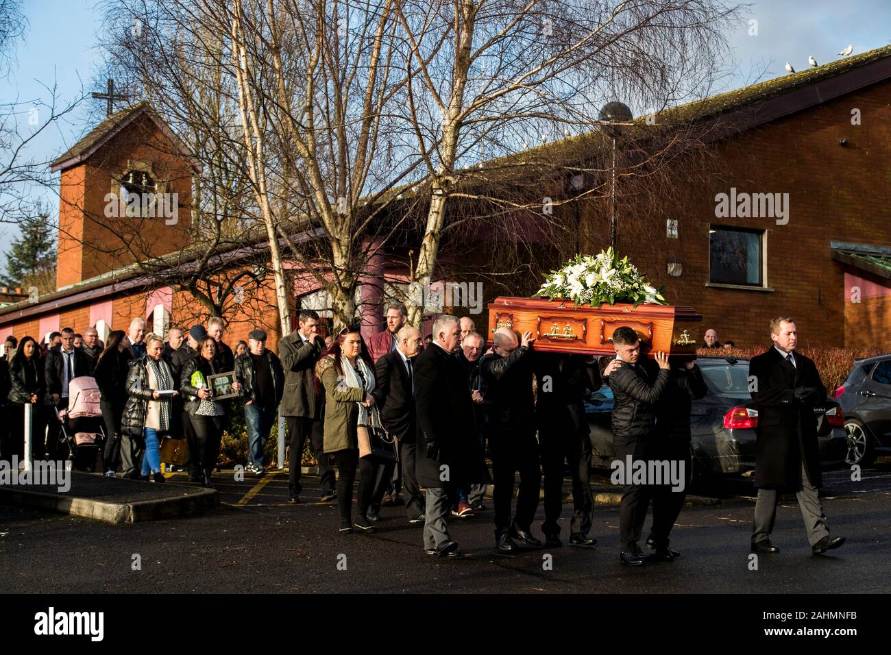 Pallbearers carry the coffin of stabbing victim Joseph (Joe) Dutton ...