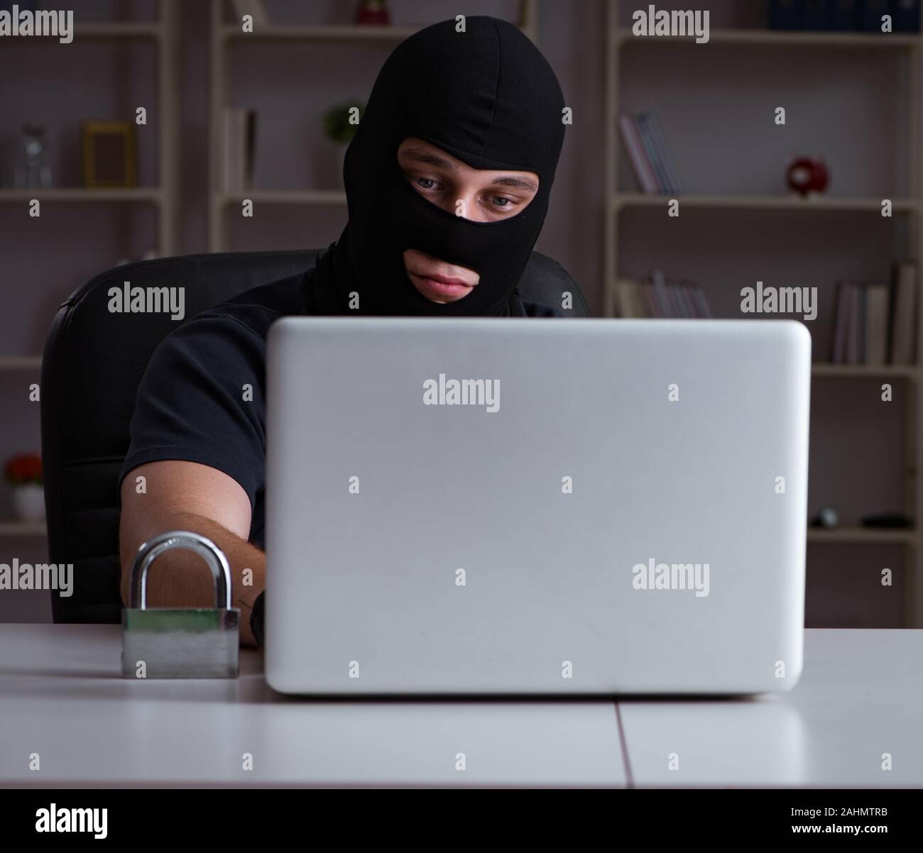 The hacker hacking computer late at night Stock Photo - Alamy