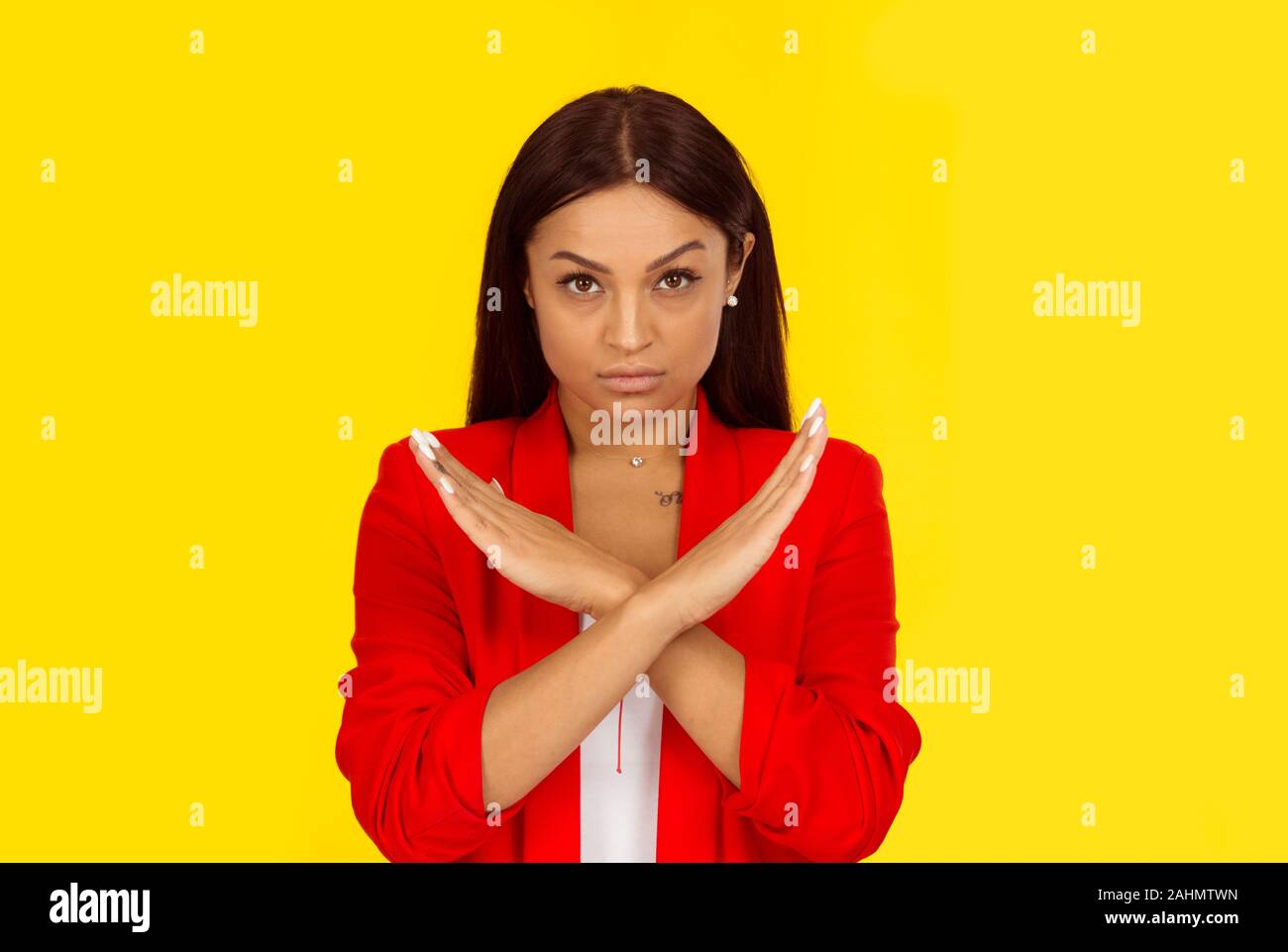 Angry pissed of woman showing stop here, halt with crossed hands ...