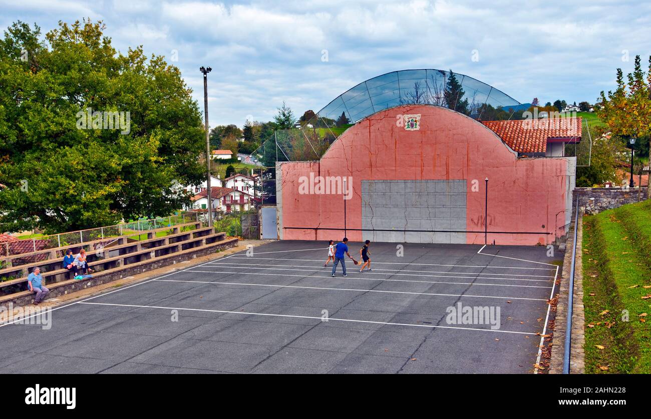 Father with children play Pelota Basque game in Espelette Village ...