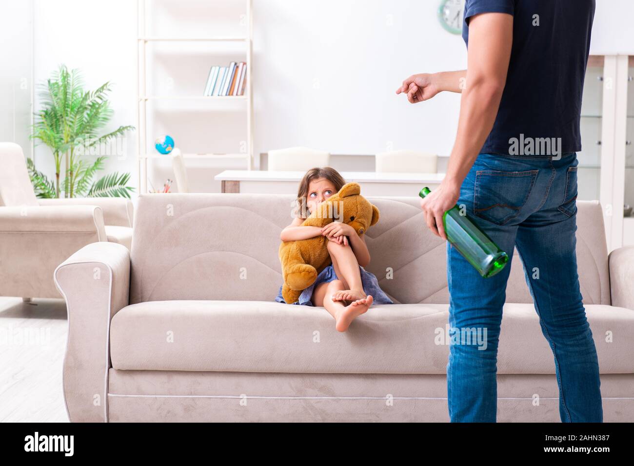 The drunk father in domestic child abuse and violence concept Stock ...