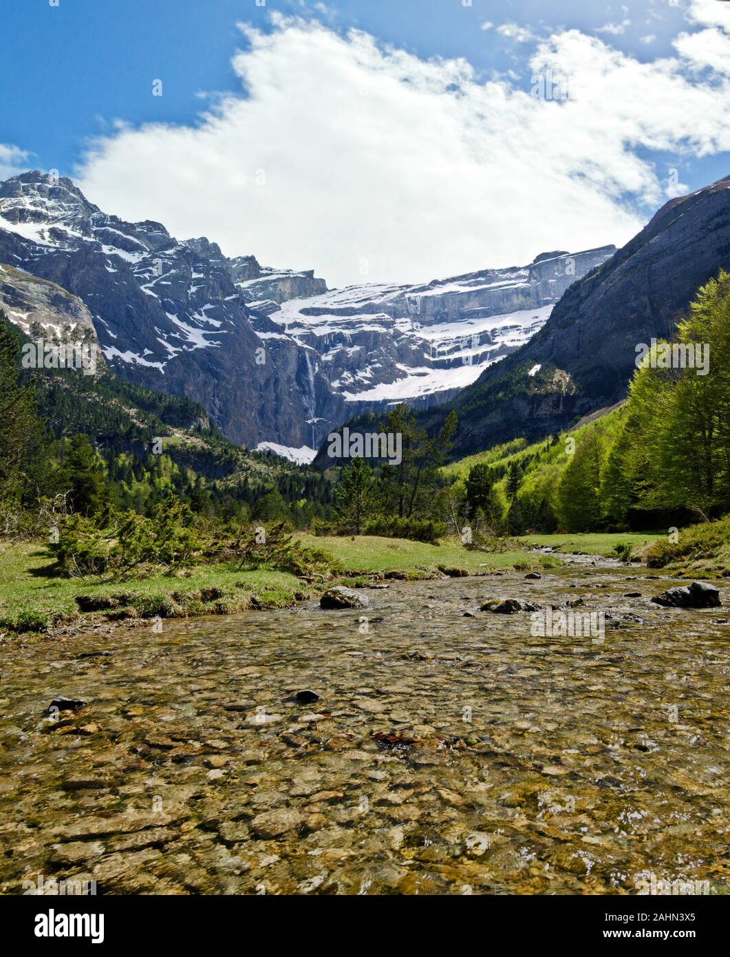 The flow of gave de Gavarnie river in the valley from Circus of ...