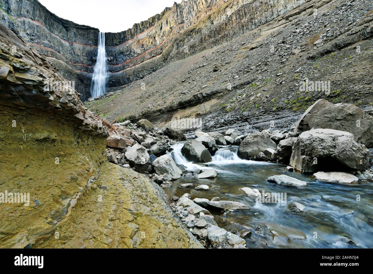 View at Hengifoss waterfall and the wall of basaltic strata with thin ...