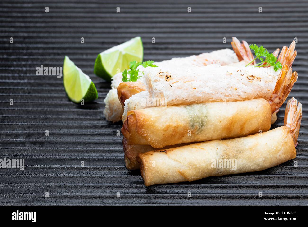 Fried king prawn crispy wrapped with lime slice on grill tray Stock ...
