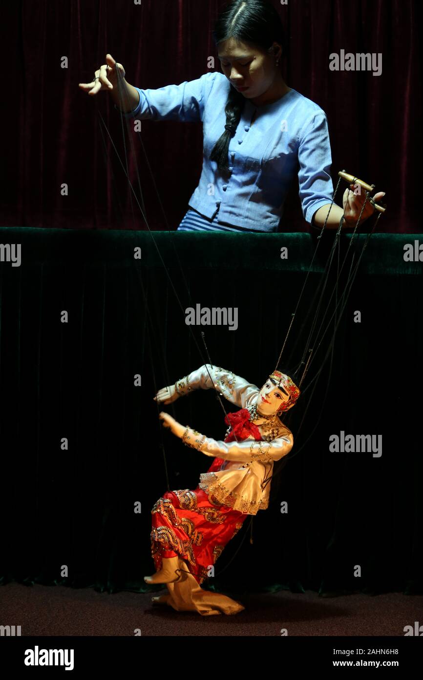 Yangon, Myanmar. 31st Dec, 2019. Thet Thet Htwe Oo performs puppet show ...