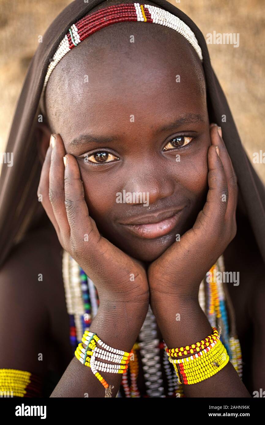 Portrait of beautiful girl from Arbore tribe with her hands on her ...