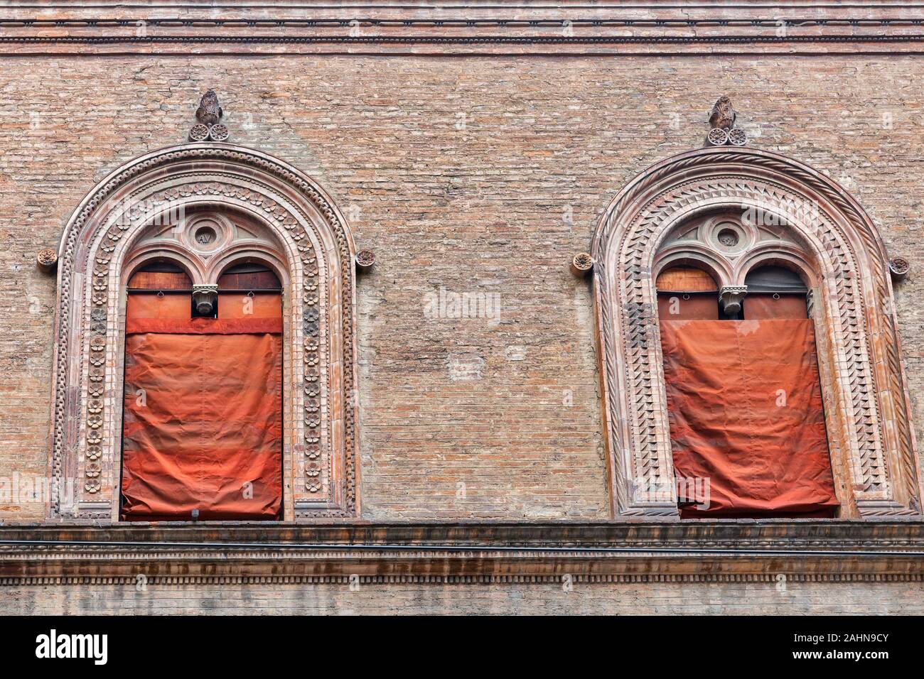 Ancient building with carved windows closeup on San Stefano street in ...