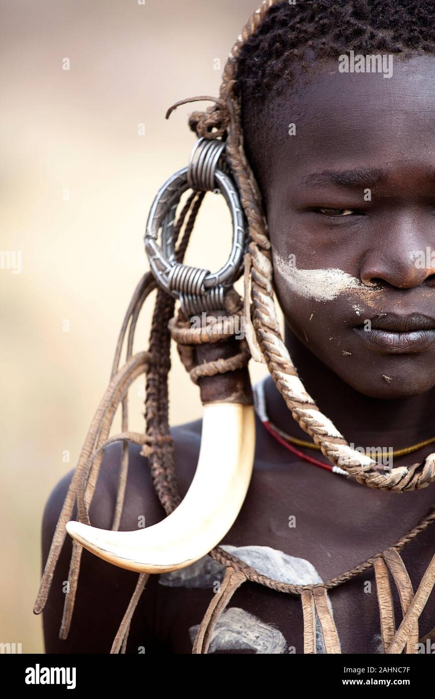 Young boy from the African tribe Mursi with traditional horns, Omo ...