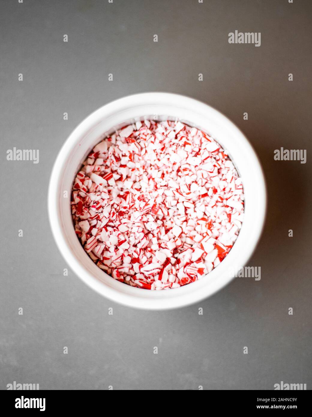 shredded candy cane peppermint in white bowl with grey matte vintage ...