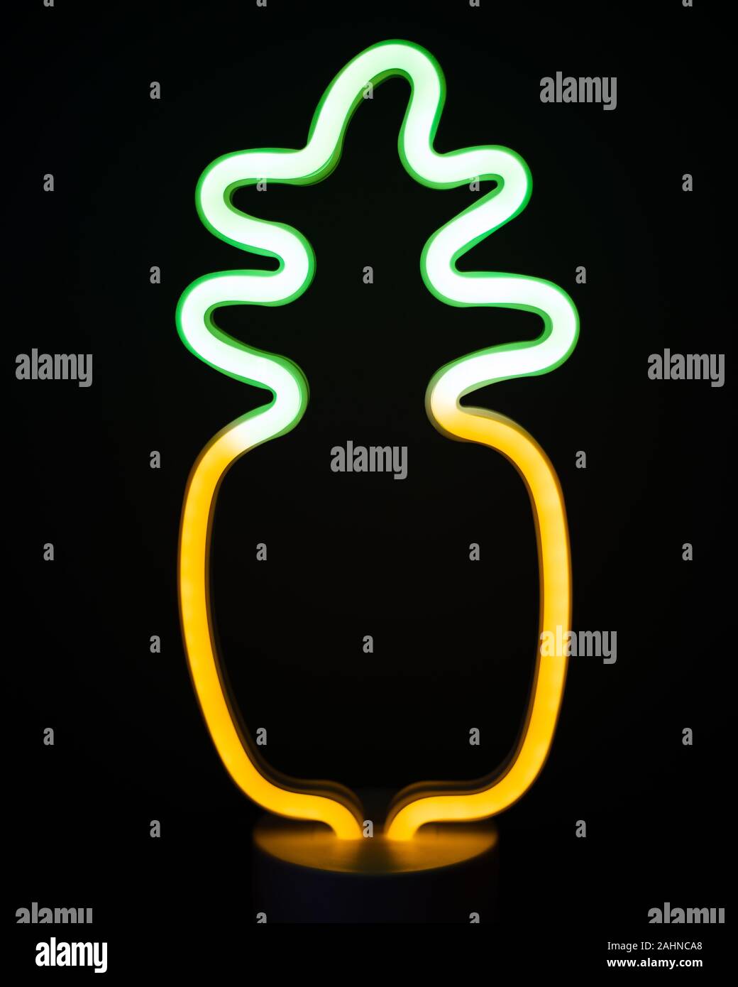 pineapple led neon light in dark room Stock Photo - Alamy