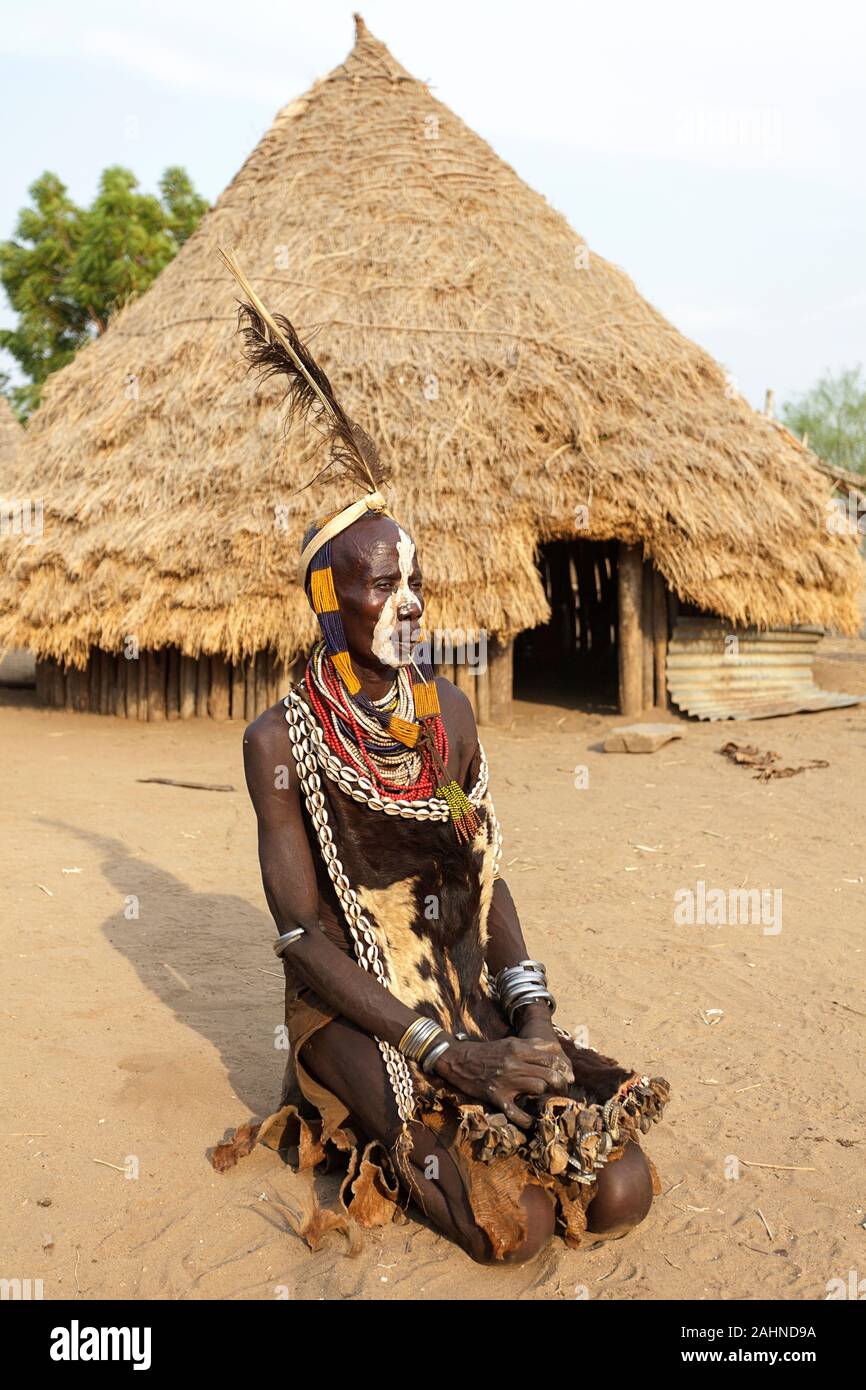 Omo valley, Karo tribe man with painted face, decoration of shells, fur ...