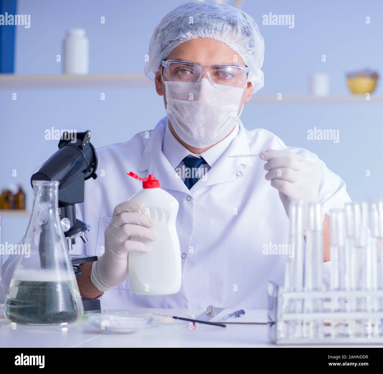 The man in the lab testing new cleaning solution detergent Stock Photo ...