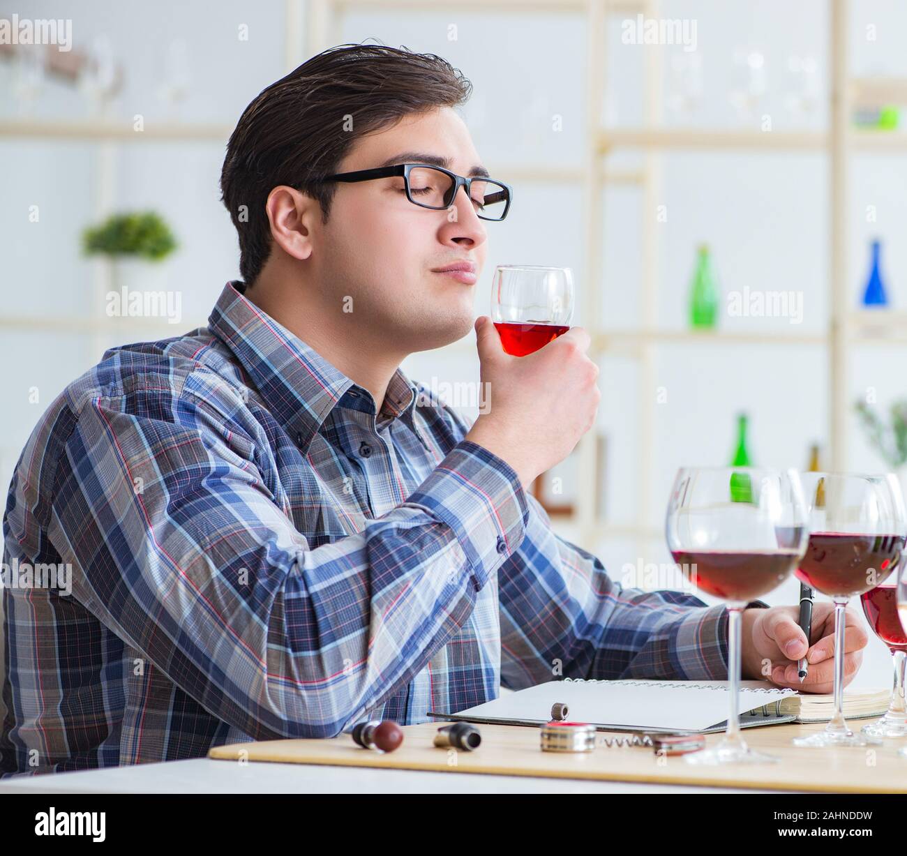 The professional sommelier tasting red wine Stock Photo - Alamy