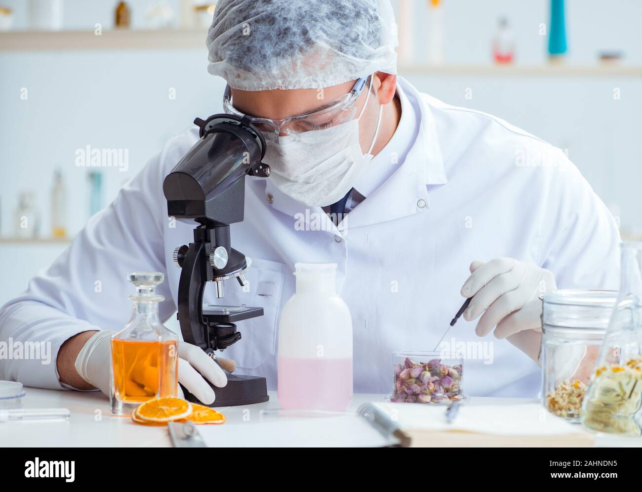 The chemist mixing perfumes in the lab Stock Photo - Alamy