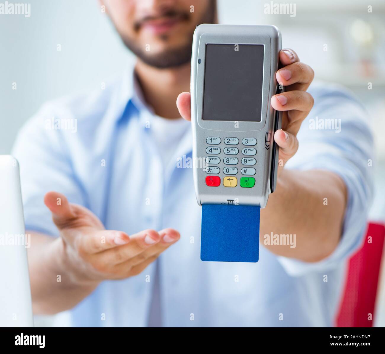 The man processing credit card transaction with pos terminal Stock ...