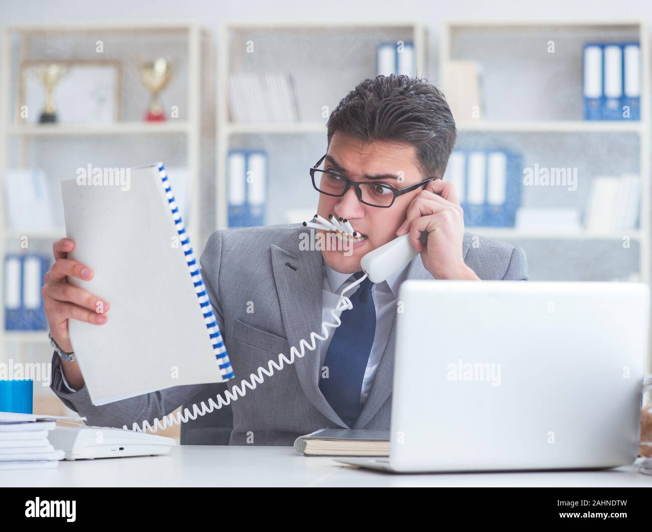 The businessman smoking in office at work Stock Photo - Alamy