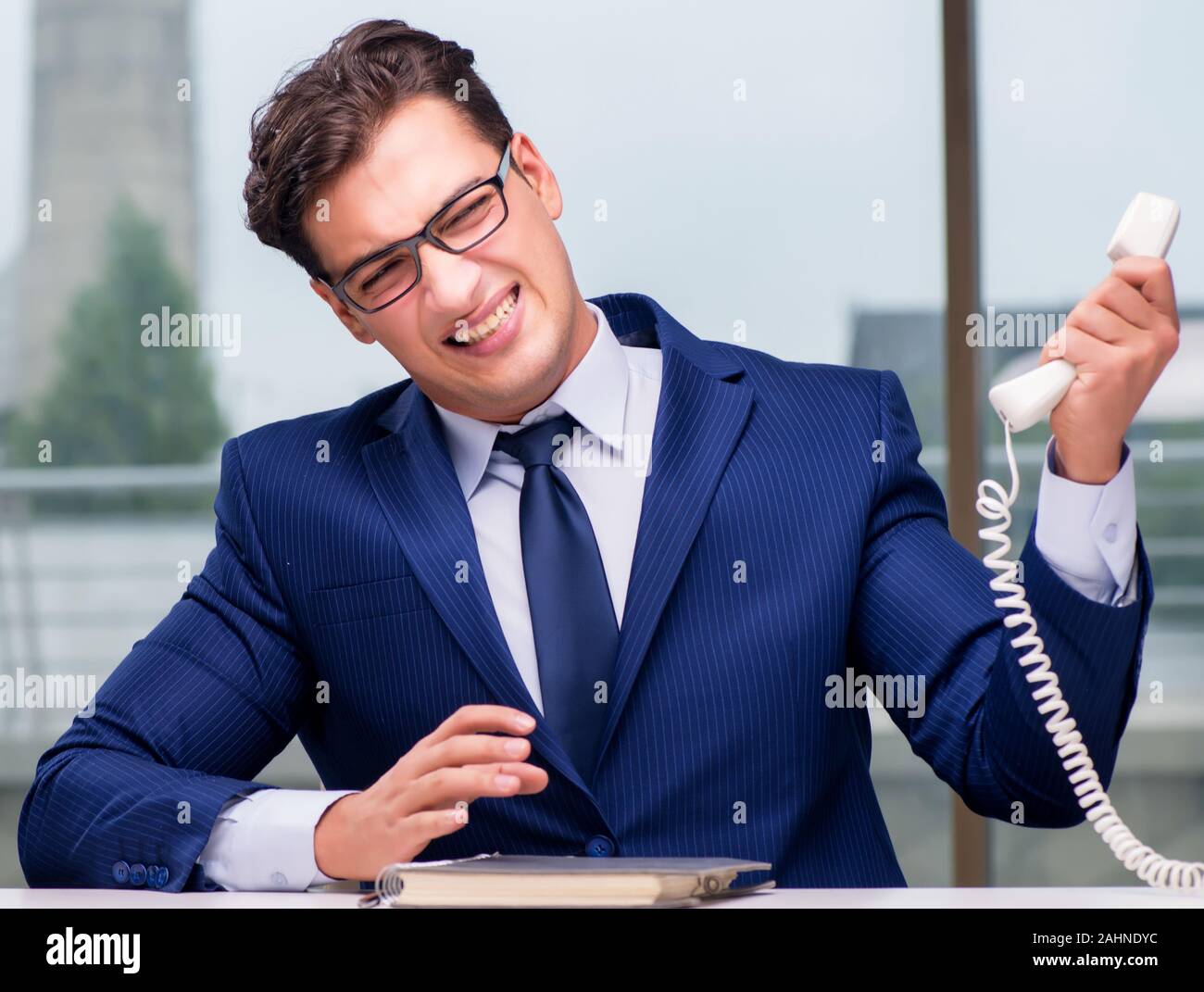 The angry call center employee yelling at customer Stock Photo - Alamy