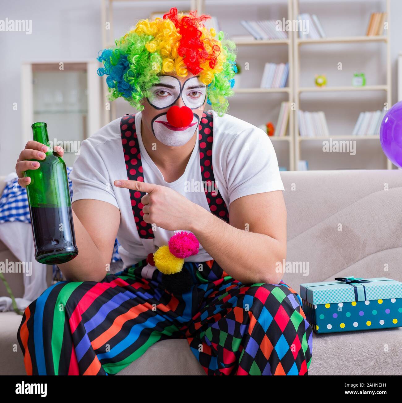 The drunk clown celebrating having a party at home Stock Photo - Alamy