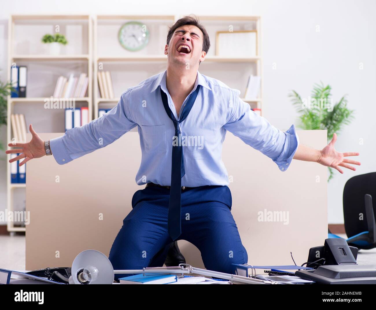 The angry businessman frustrated with too much work Stock Photo - Alamy