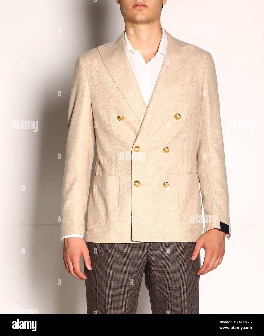 Fashionable blank dress wearing young men and standing on white ...
