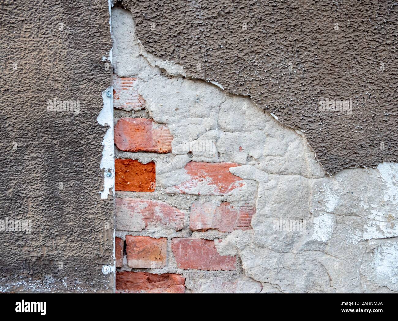 Building damage plaster on a house wall Stock Photo - Alamy
