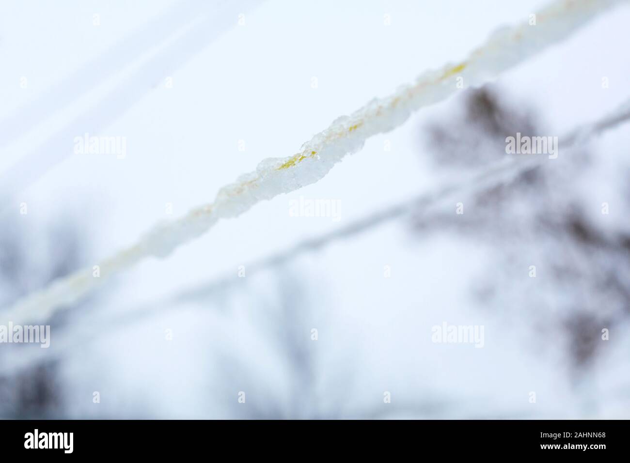 An iced rope for drying clothes. Drying clothes in winter Stock Photo ...