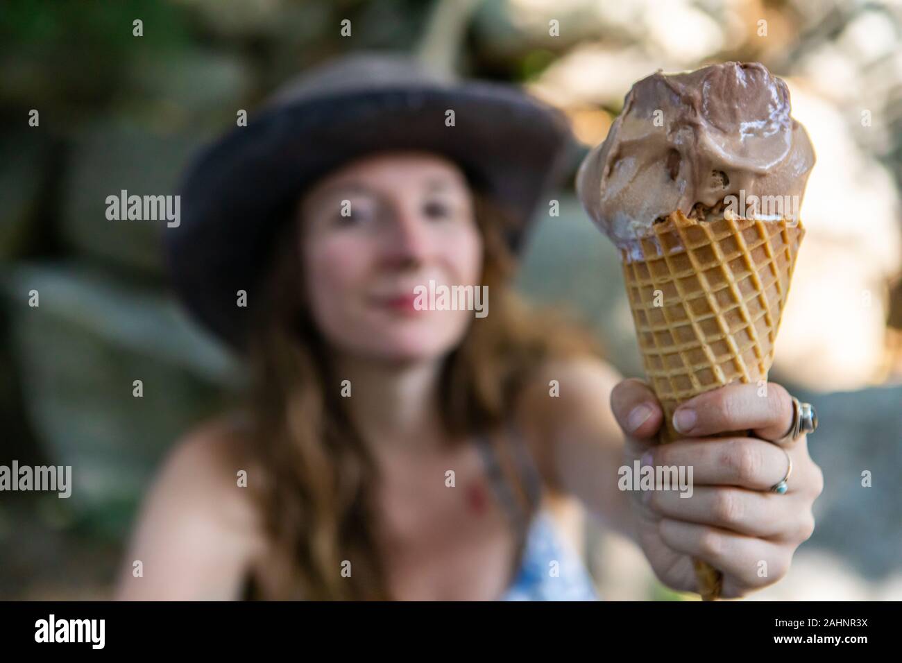 A closeup and point of view perspective of an ice cream cone. being ...