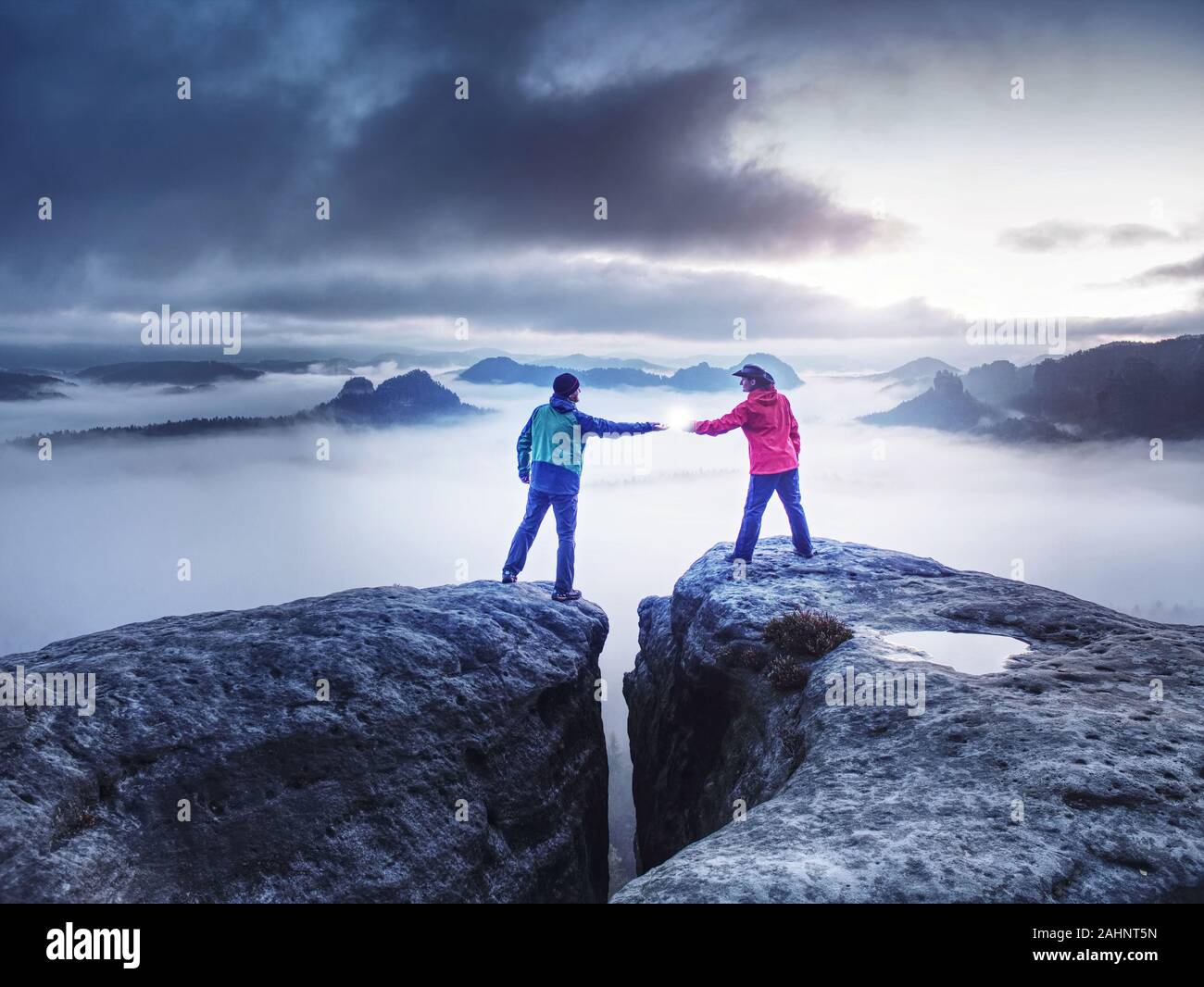 Woman save light. She put shinning lantern to man hands. protect your ...