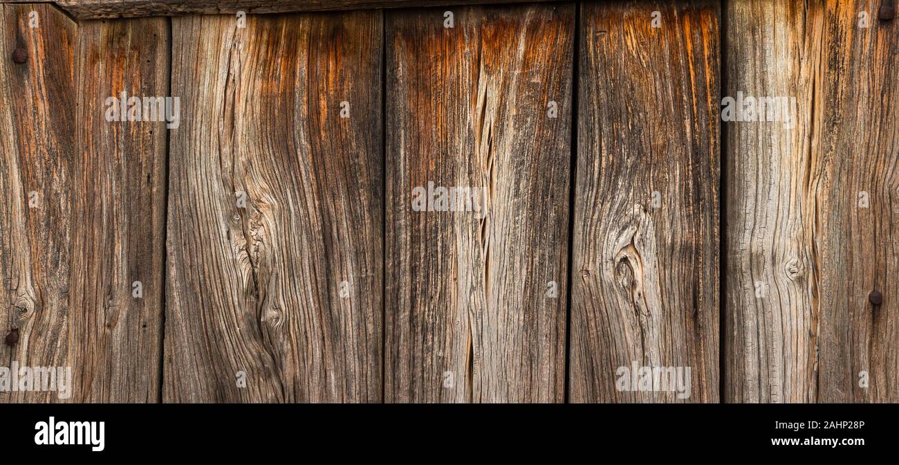 Old wooden boards with iron nails, holes and worn varnish background ...