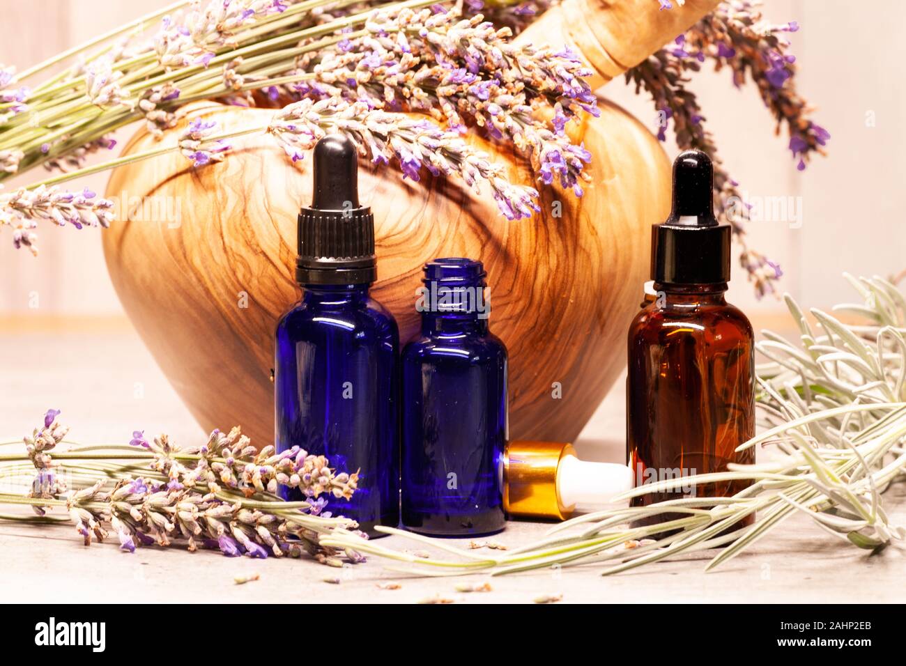 lavender mortar and pestle and bottles of essential oils for aromatherapy Stock Photo - Alamy