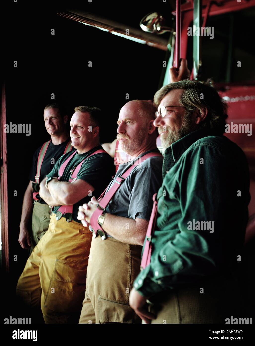 A profile of firemen looking on Stock Photo - Alamy