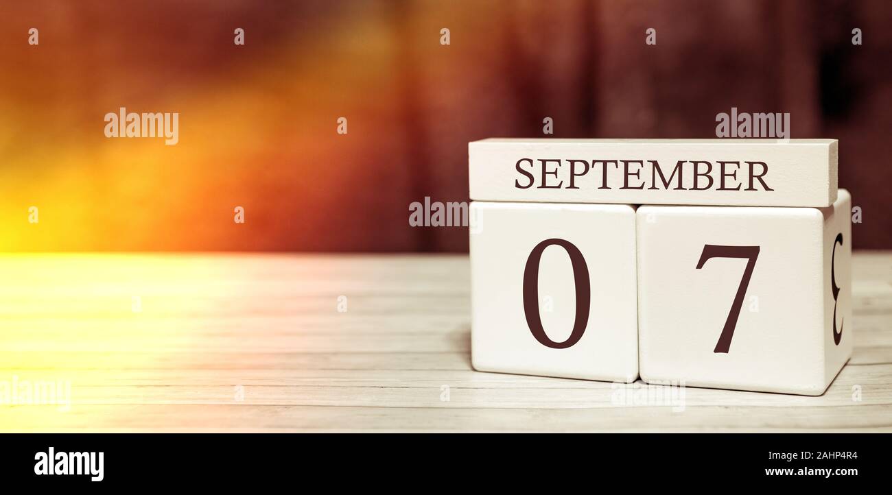 Calendar reminder event concept. Wooden cubes with numbers and month on ...
