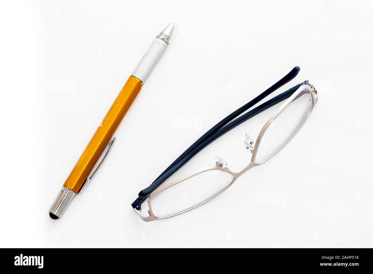 Fashion reading glasses and pen on white background Stock Photo - Alamy