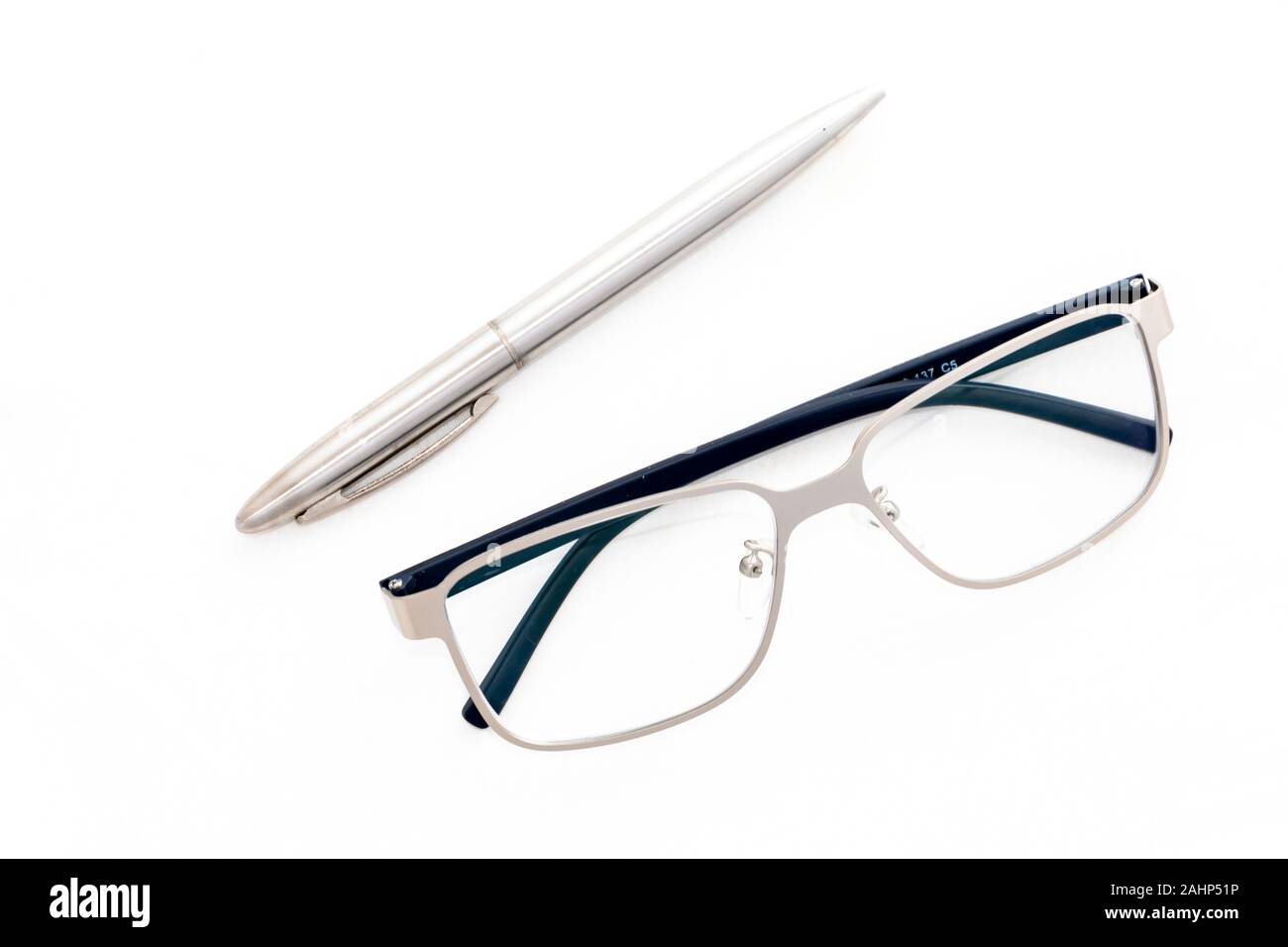 Fashion reading glasses and pen on white background Stock Photo - Alamy