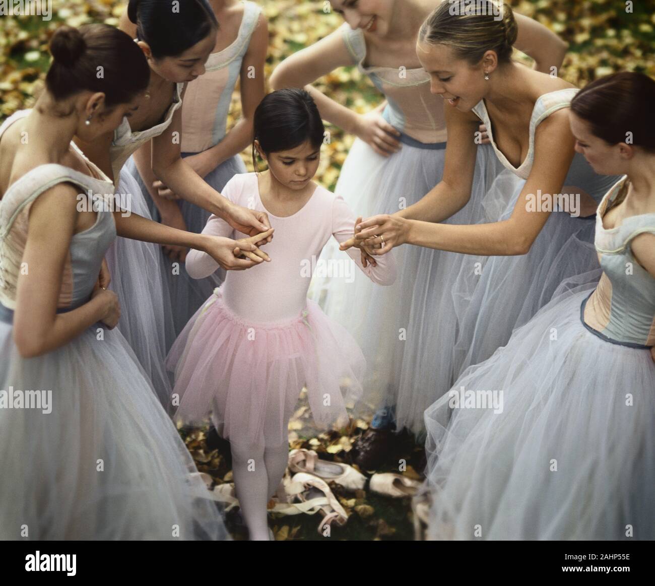 A group of young ballerinas playing together Stock Photo - Alamy
