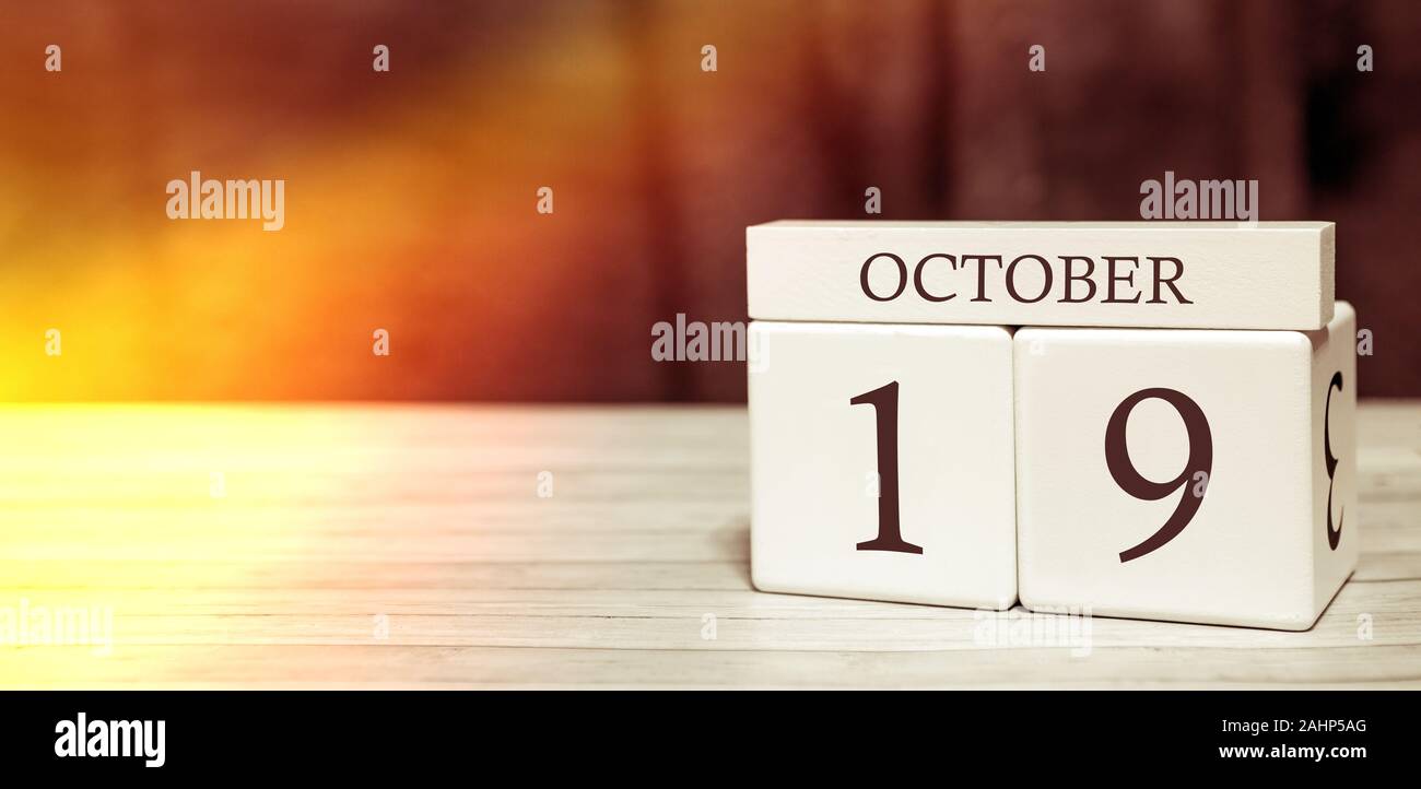 Calendar reminder event concept. Wooden cubes with numbers and month on ...