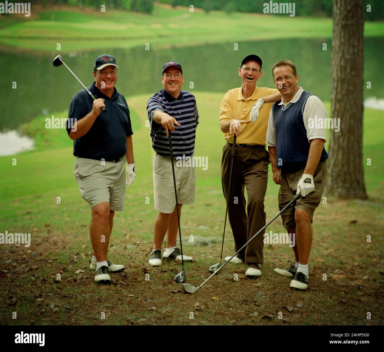 Golfing friends standing together for a photograph Stock Photo - Alamy