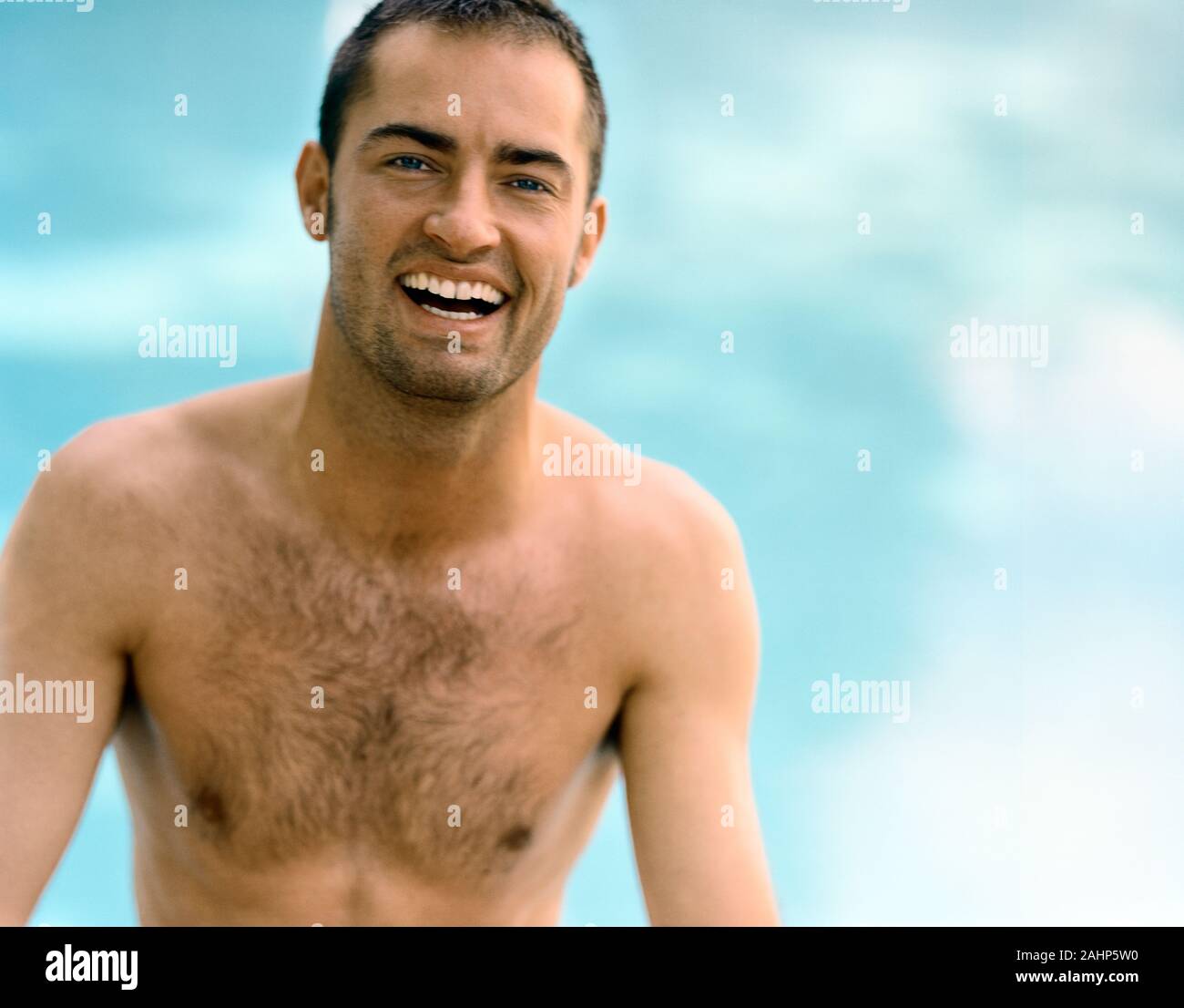 A young man cooling off in a pool Stock Photo - Alamy
