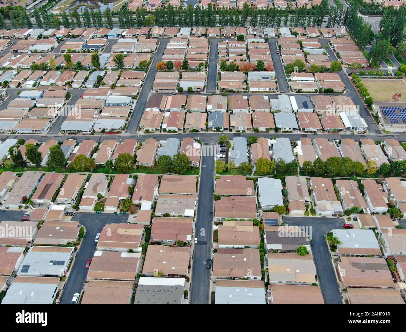 Aerial view of urban sprawl. Suburban packed homes neighborhood with ...