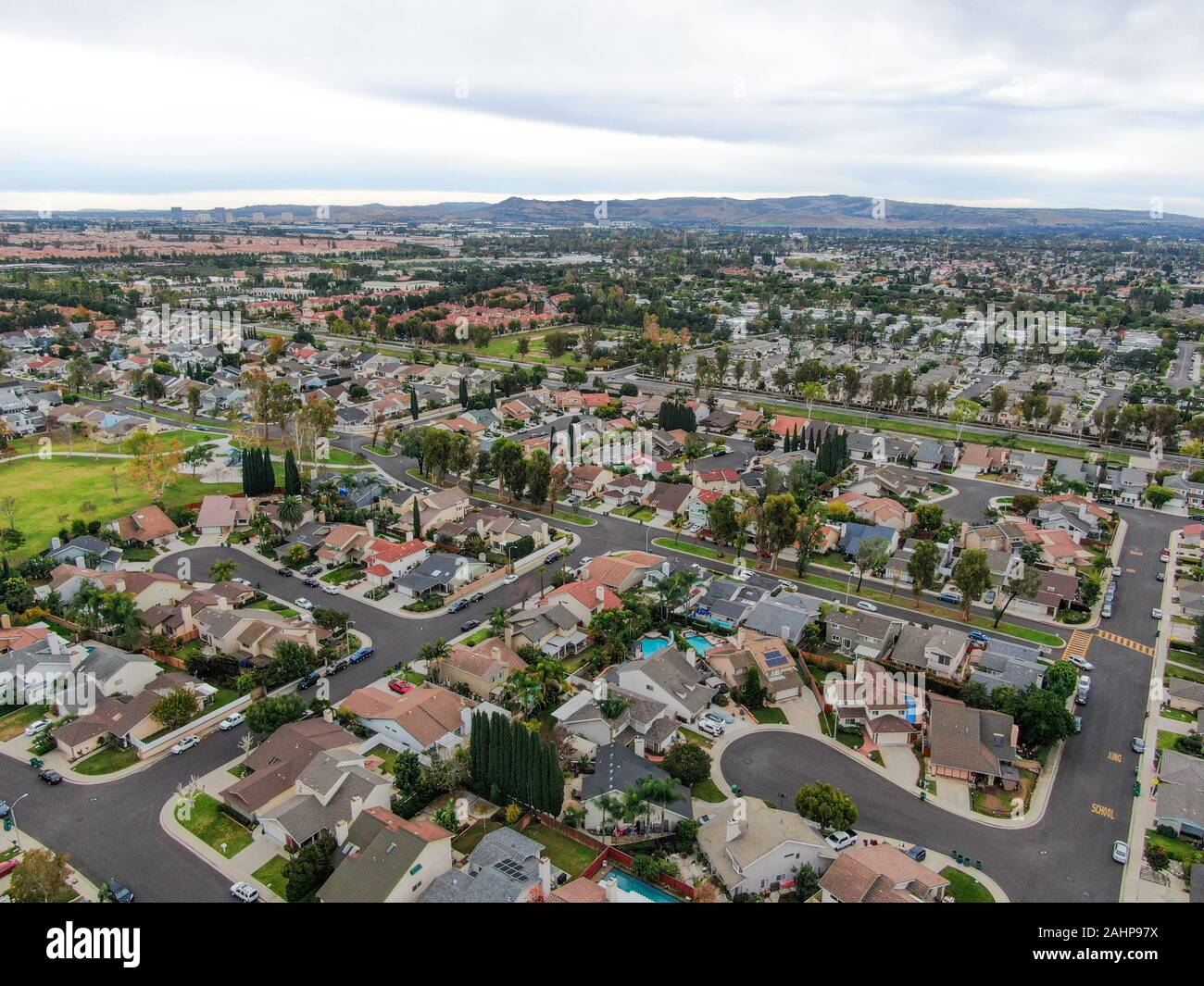 Aerial view of urban sprawl. Suburban packed homes neighborhood with ...