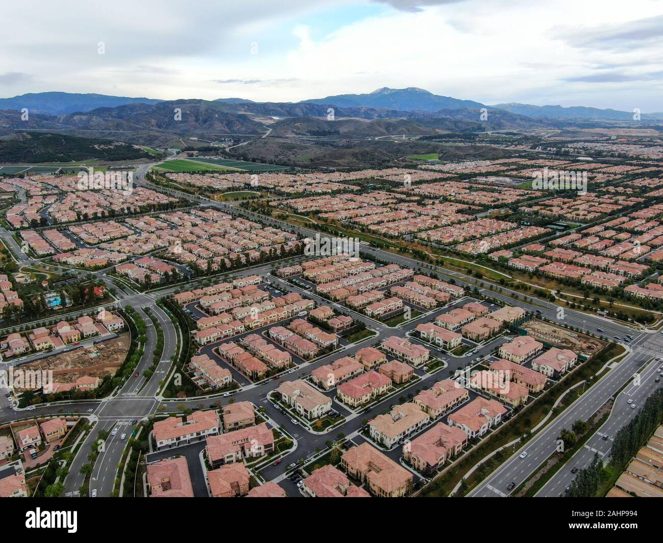 Aerial view of urban sprawl. Suburban packed homes neighborhood with ...