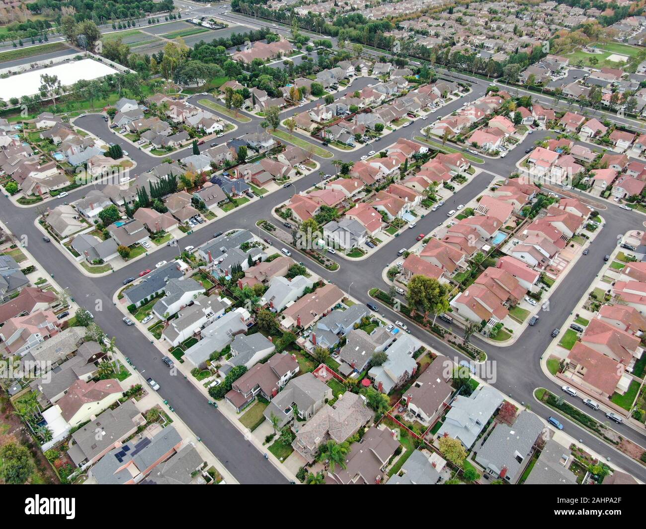 Aerial view of urban sprawl. Suburban packed homes neighborhood with ...