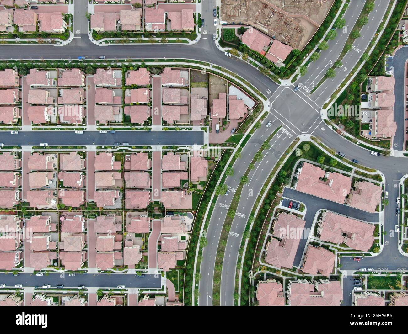 Aerial top view of urban sprawl. Suburban packed homes neighborhood ...